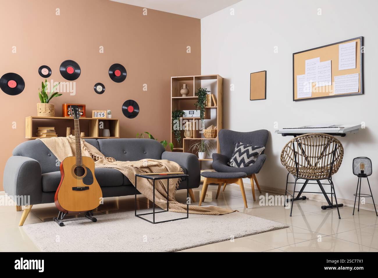 Interior of living room with musical instruments, sofa and shelf units ...