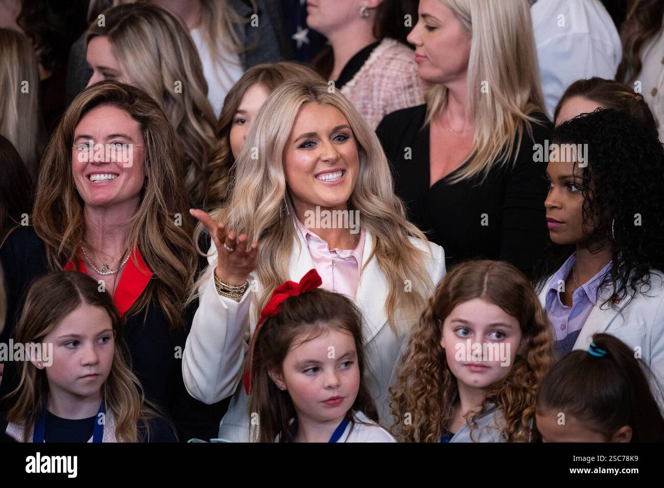 Former collegiate swimmer Riley Gaines stands with other advocates ...