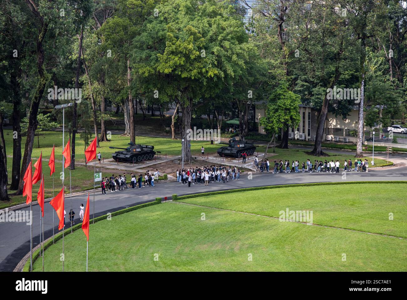 Tourists and tanks in front of the Independence Palace (also known as the Reunification Congress ...