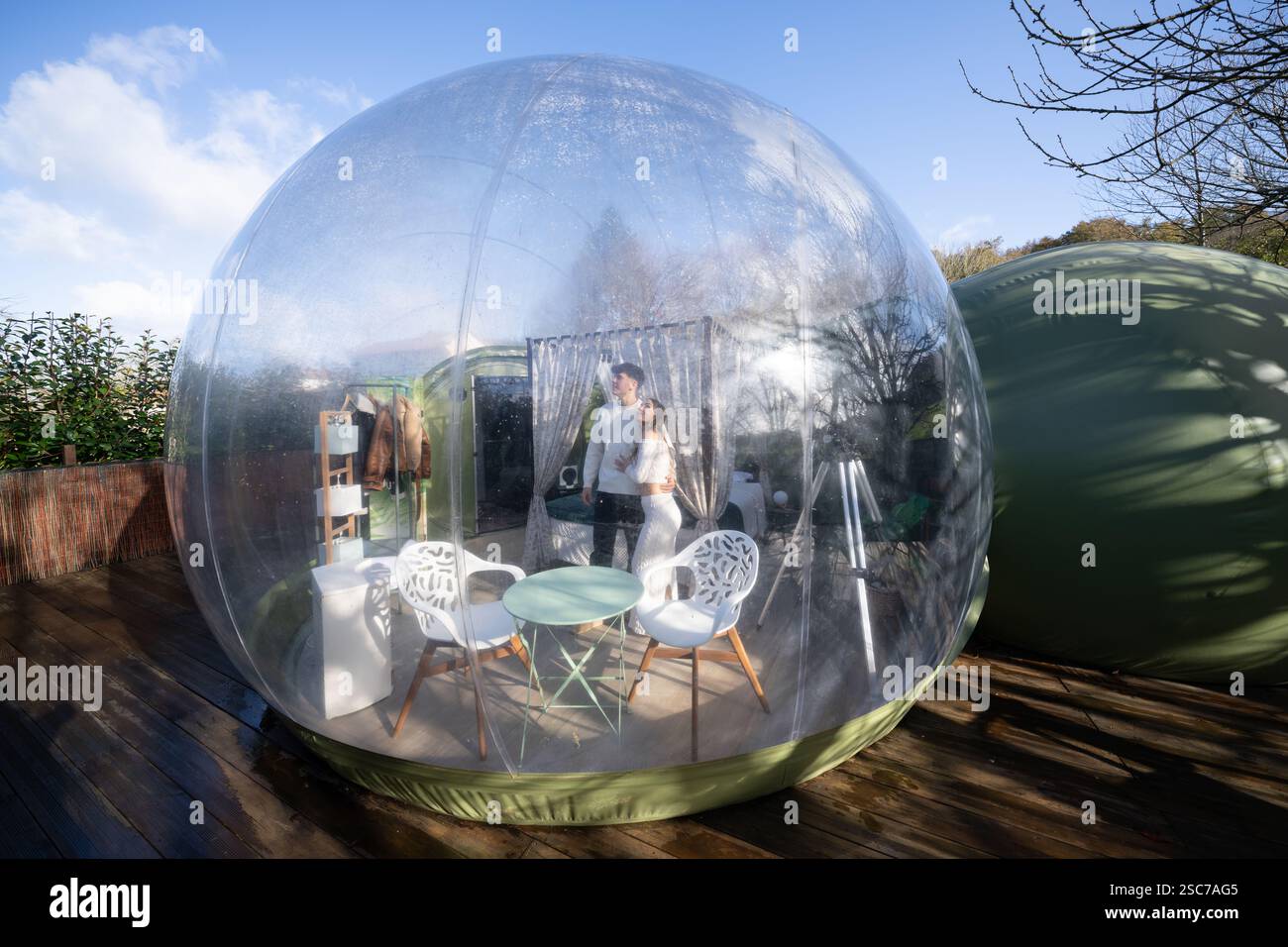 Romantic glamping scene featuring transparent bubble accommodation ...