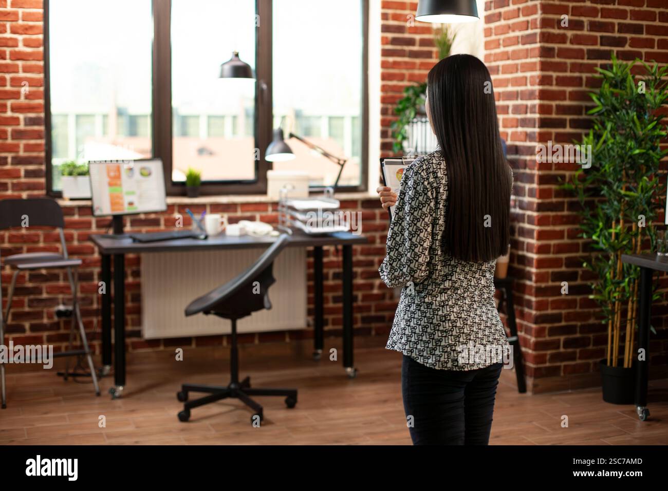 Professional asian woman holding financial documents enters startup ...