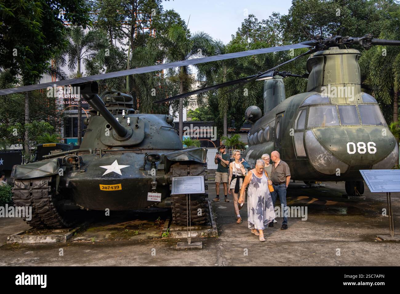 People look at tanks and CH-47 Chinook helicopters of the US Army in ...