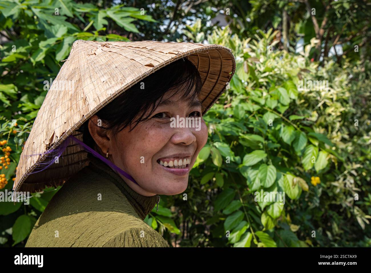 Smiling woman with traditional Vietnamese conical hat, Quoi Son, Chau ...
