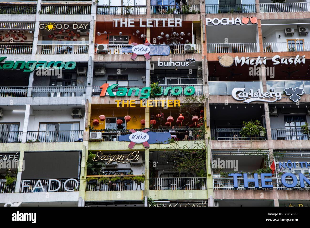 High-rise building with many advertising signs in the city center, Ho ...