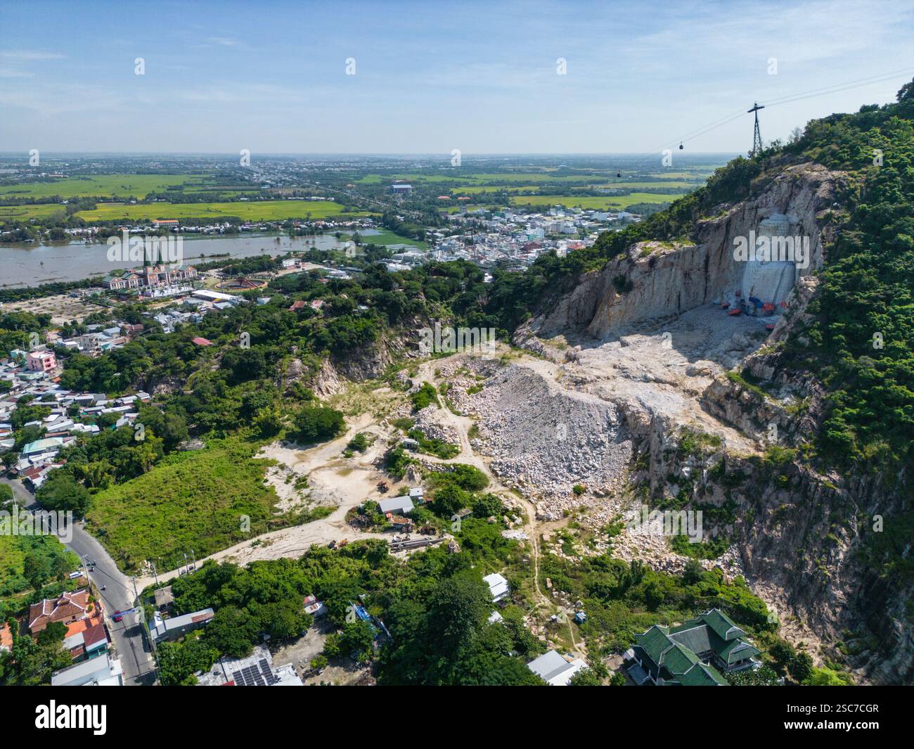 Aerial view of a giant Buddha sculpture on the mountainside (still ...