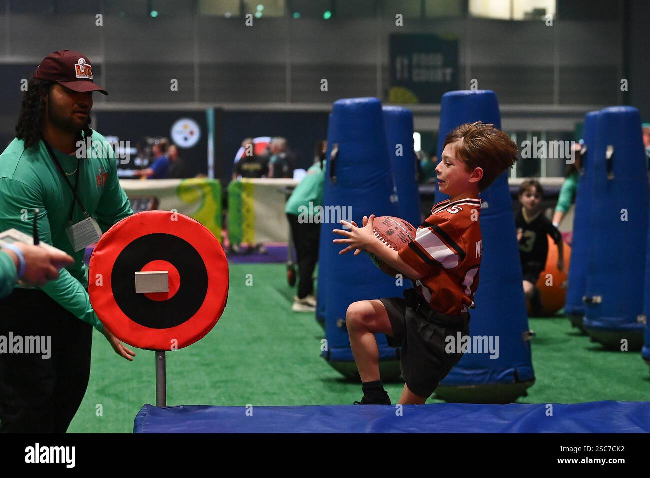 Caesars Superdome. 5th Feb, 2025. New Orleans LA; A young fan catches a ...