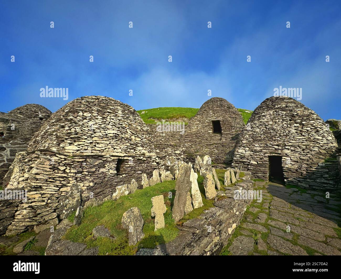 Monks graveyard with beehive monastic cells on Skellig Michael, County ...