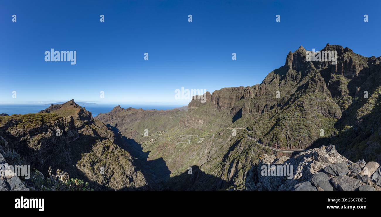 The mountain village of Masca surrounded by volcanic rock formations ...
