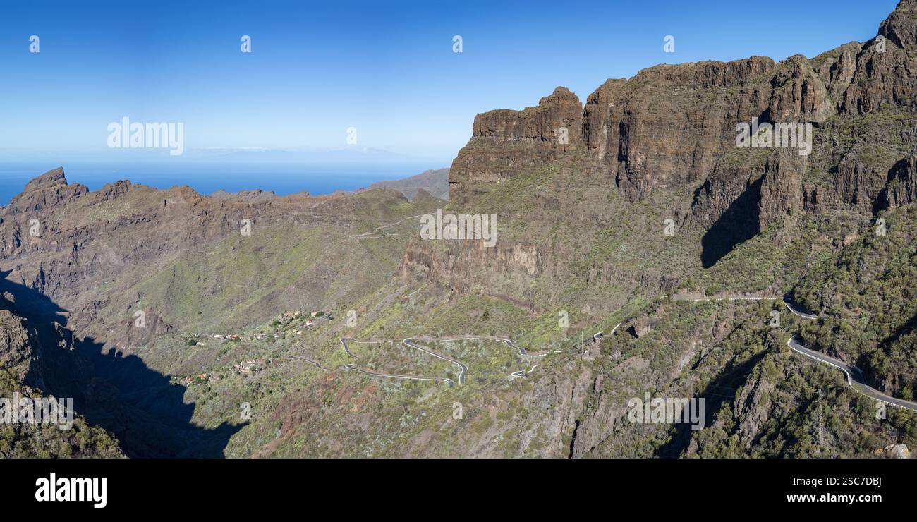 The mountain village of Masca surrounded by volcanic rock formations ...