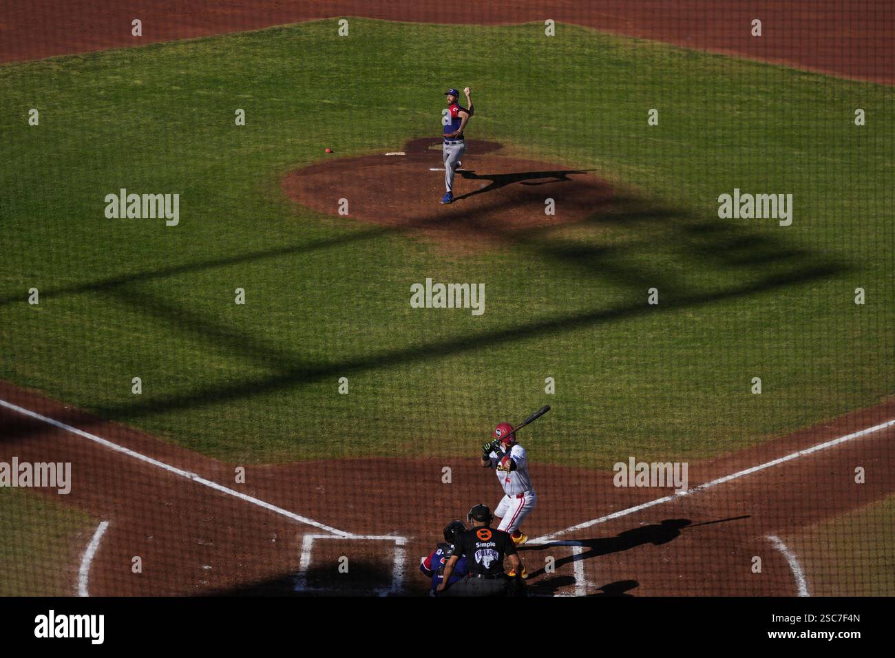 Dominican Republic's Brooks Hall pitches against Venezuela's Gorkys ...