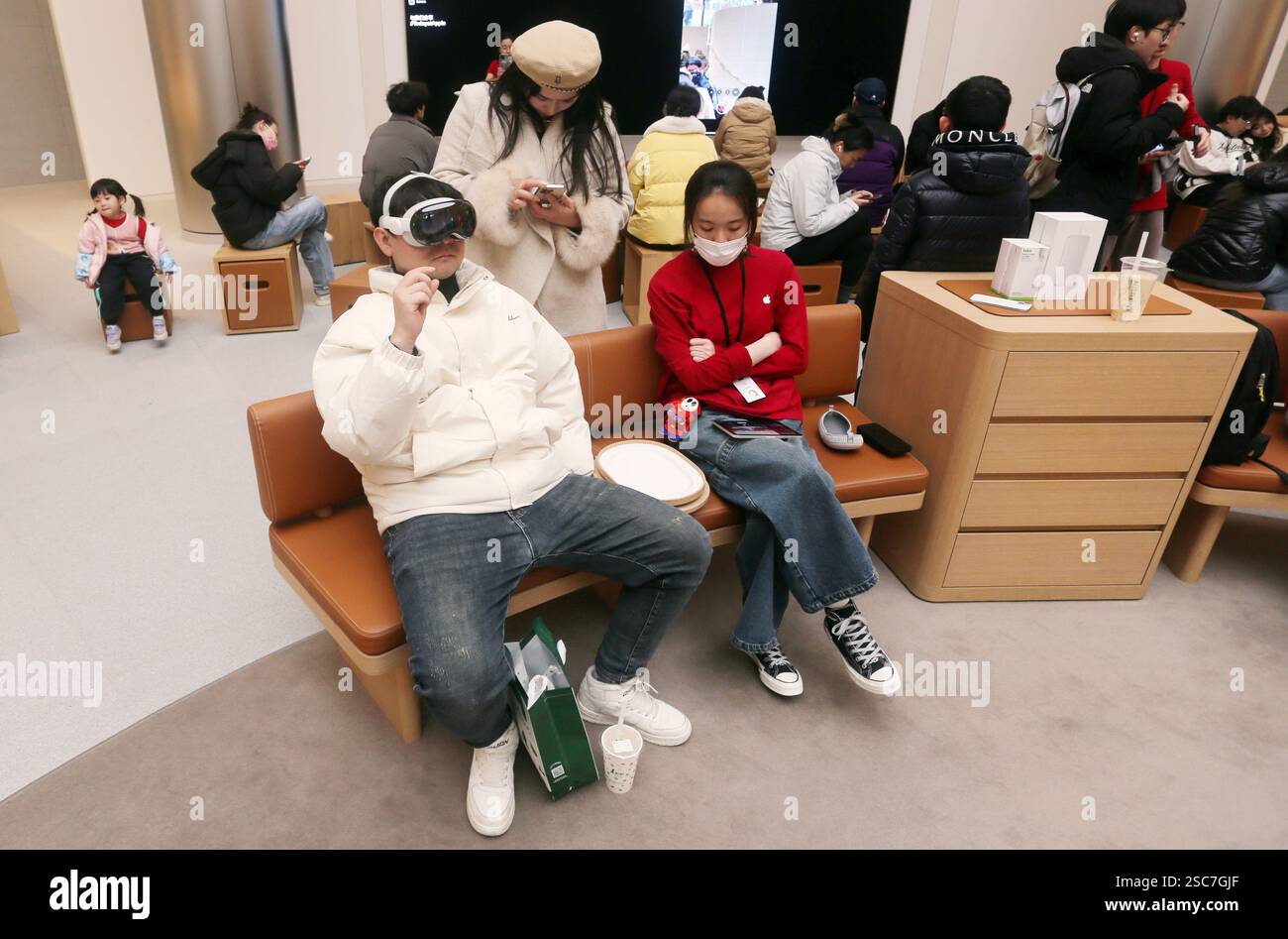 SHANGHAI, CHINA - FEBRUARY 4, 2025 - Customers experience the Apple Vision Pro at the popular ...
