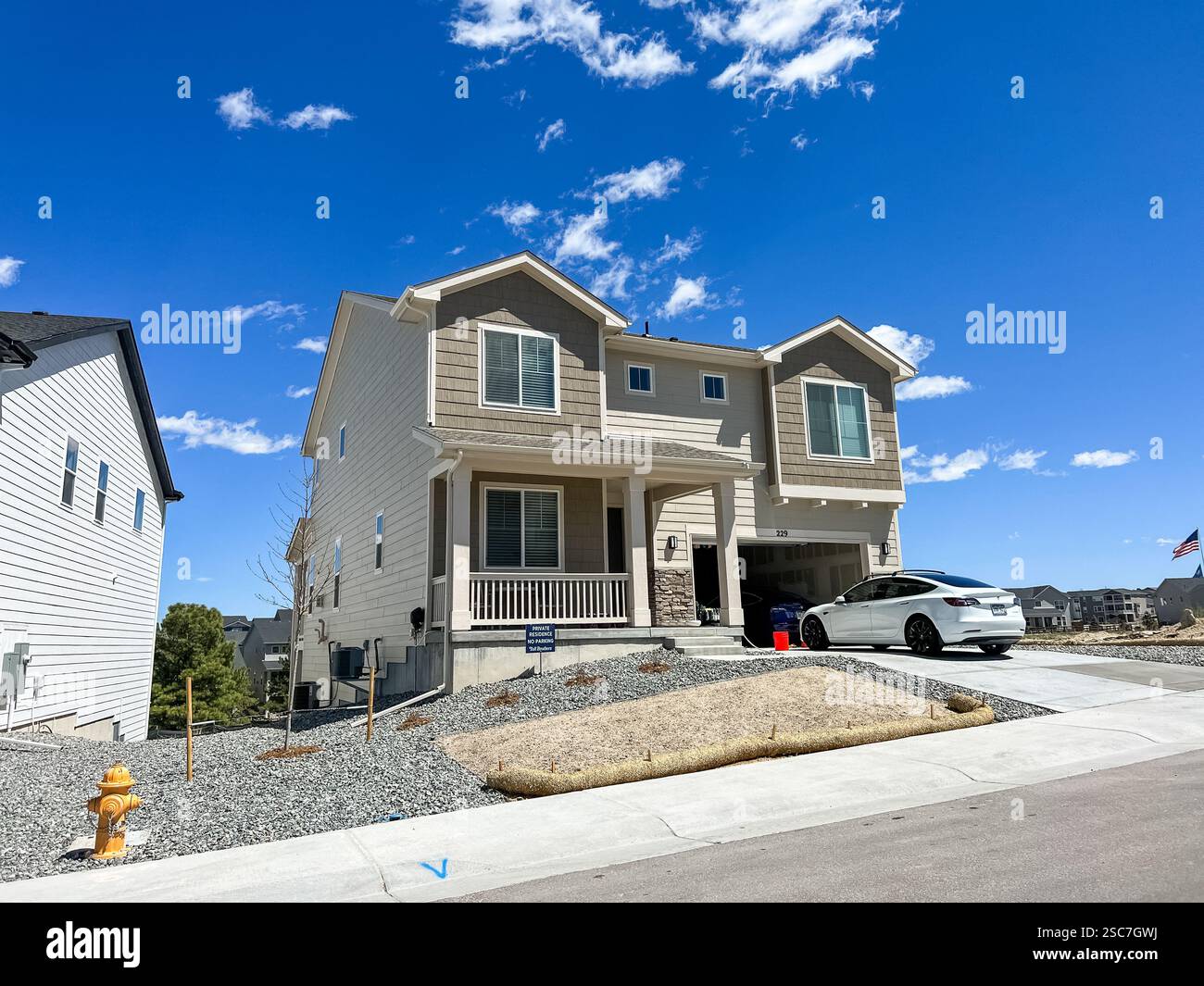 Modern two story suburban house with garage Stock Photo - Alamy