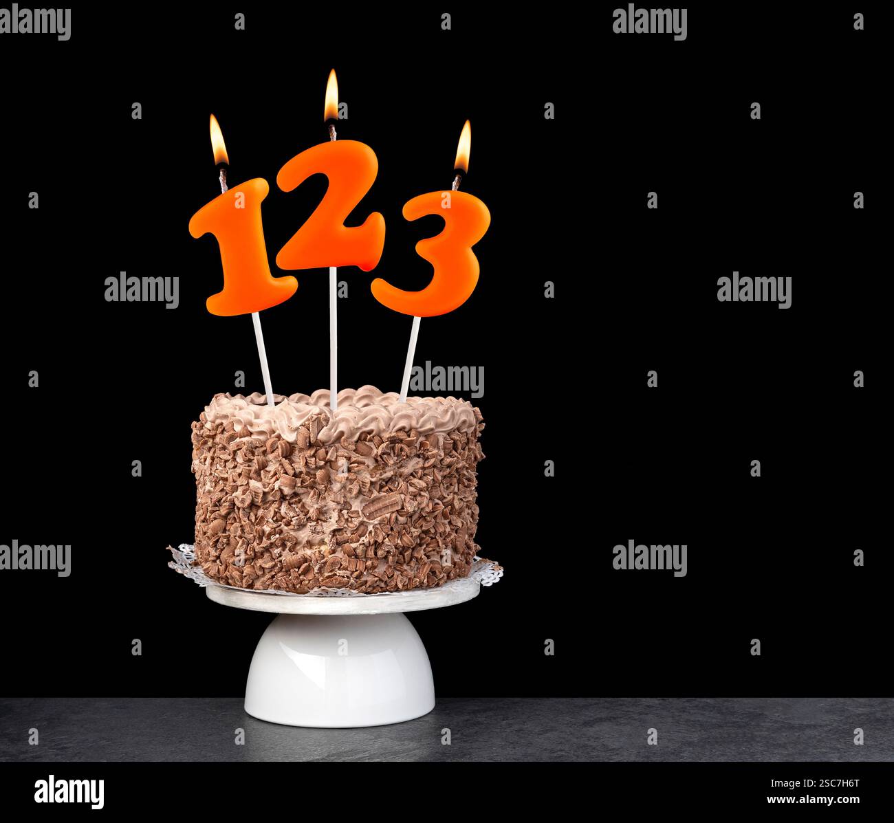 Birthday cake with number 123 candle - Anniversary card on a black ...