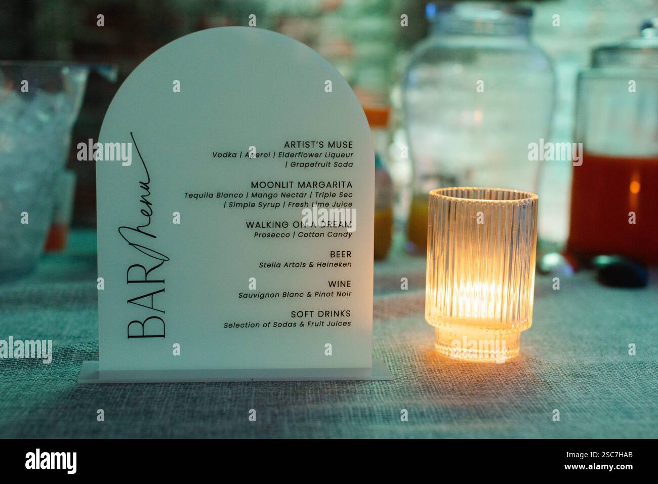 The stylish bar menu features a selection of cocktails, wines, and soft ...