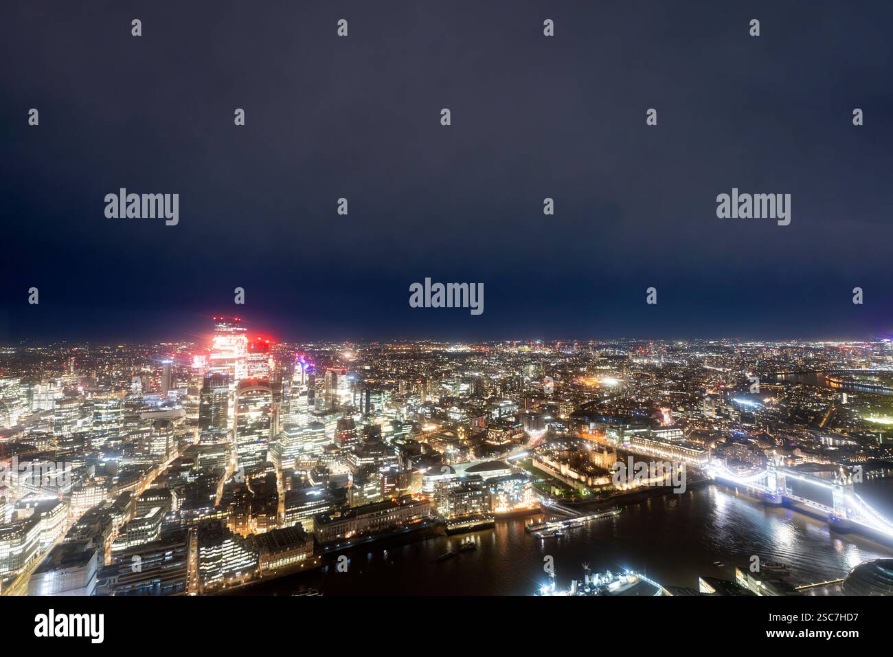 Night view of London, England, from a high vantage point. Tower Bridge ...