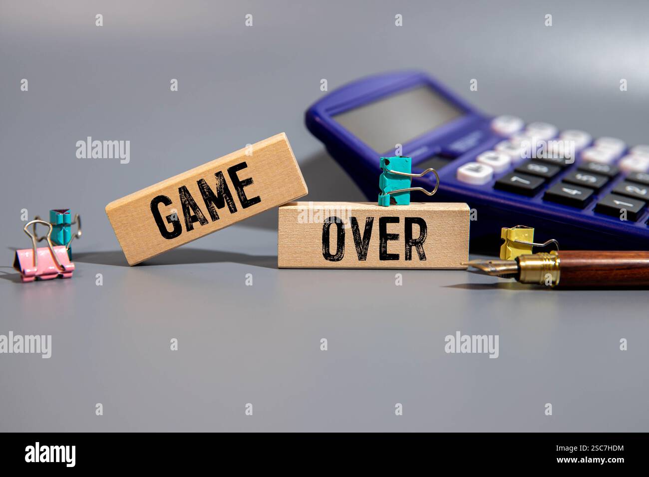 cube wooden concept with game over text, white background. plant pot ...