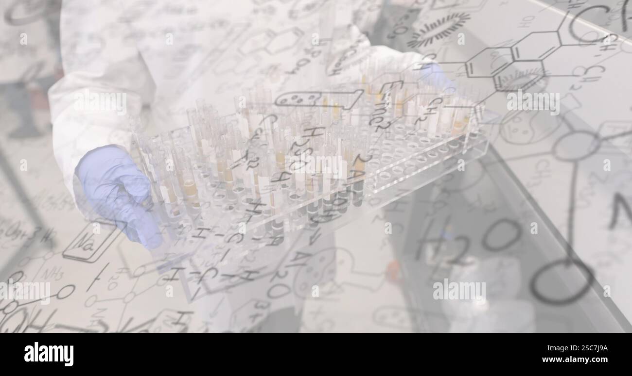 Chemical formulas image over scientist handling test tubes in ...