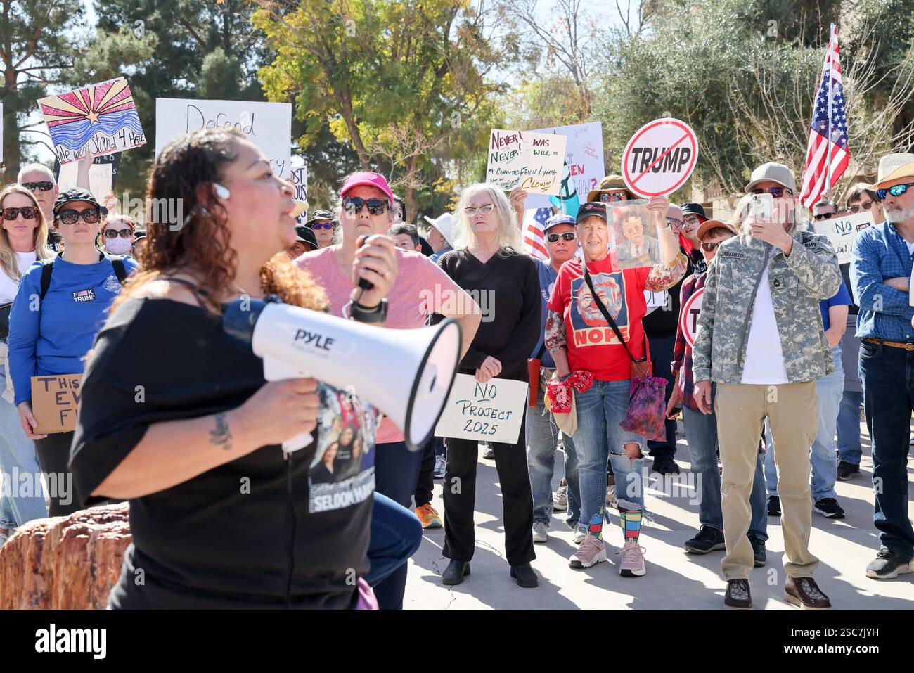 Phoenix, USA. 05th Feb, 2025. Organizer Clarissa speaks on a bull horn ...