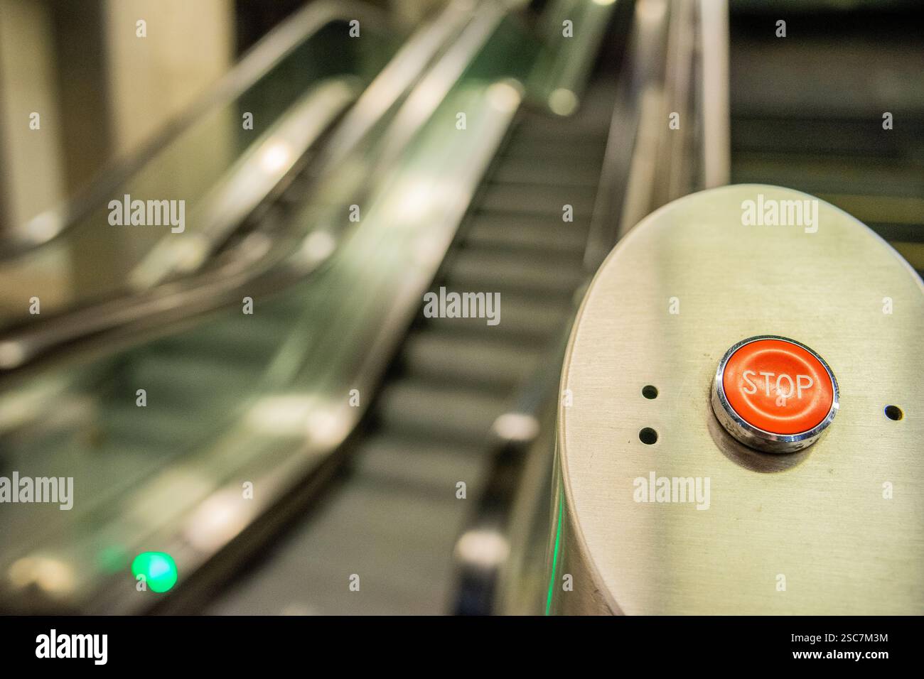 On the right side of the escalator emergency stop button on the left ...
