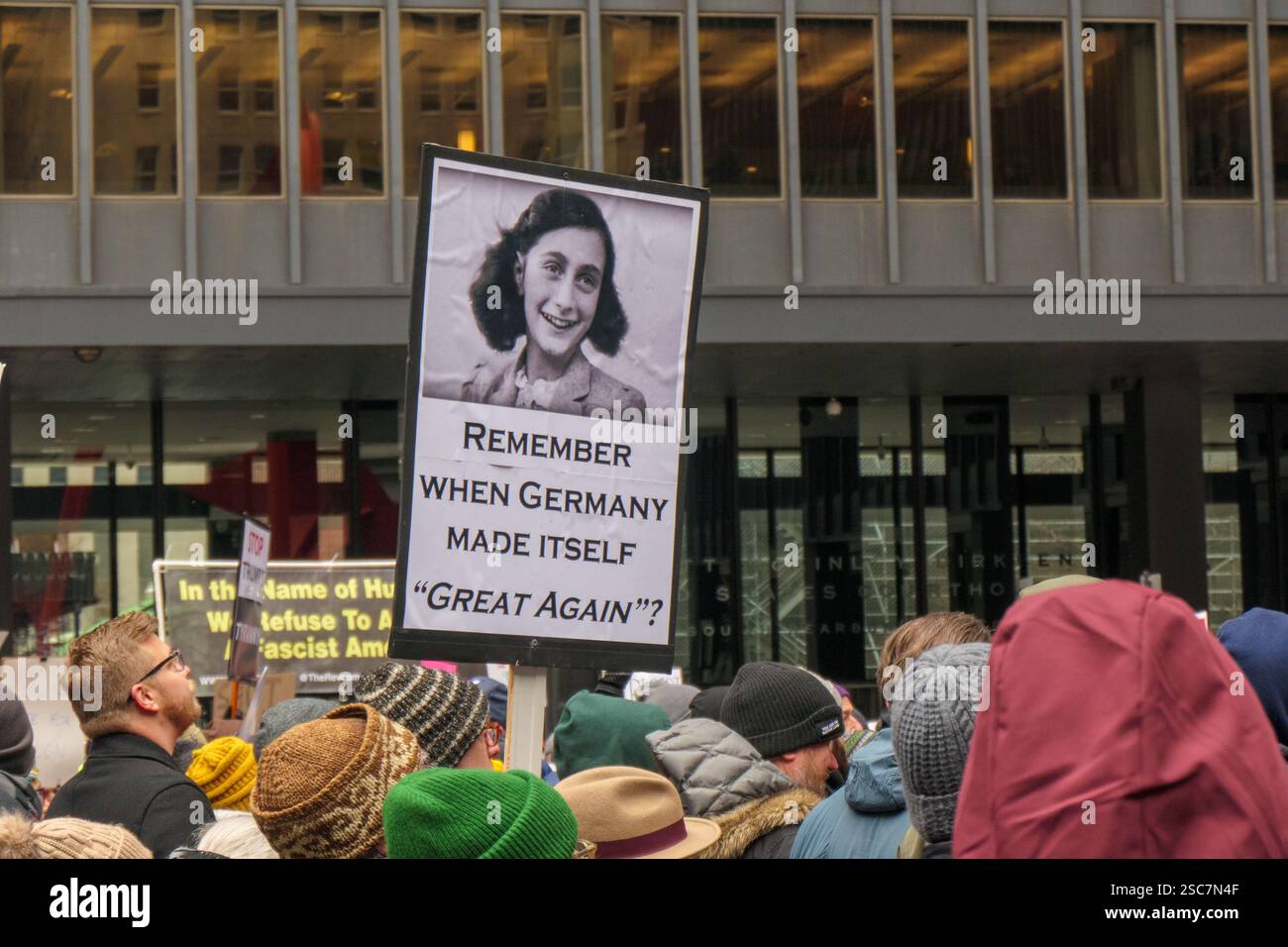 Protest sign with photo of Anne Frank at protest against Donald Trump ...