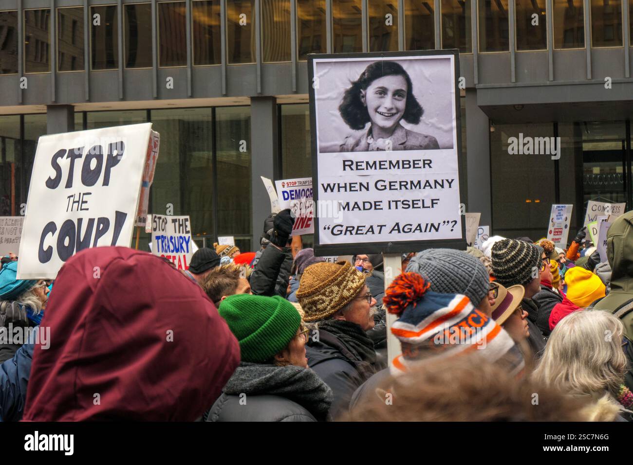 Protest sign with photo of Anne Frank at protest against Donald Trump ...