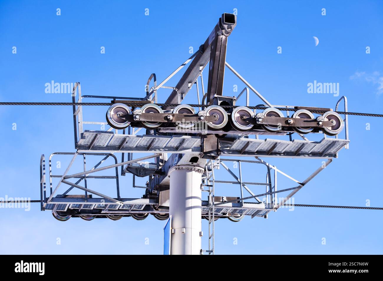 Ski lift machinery showing detailed pulleys and cables set against a ...