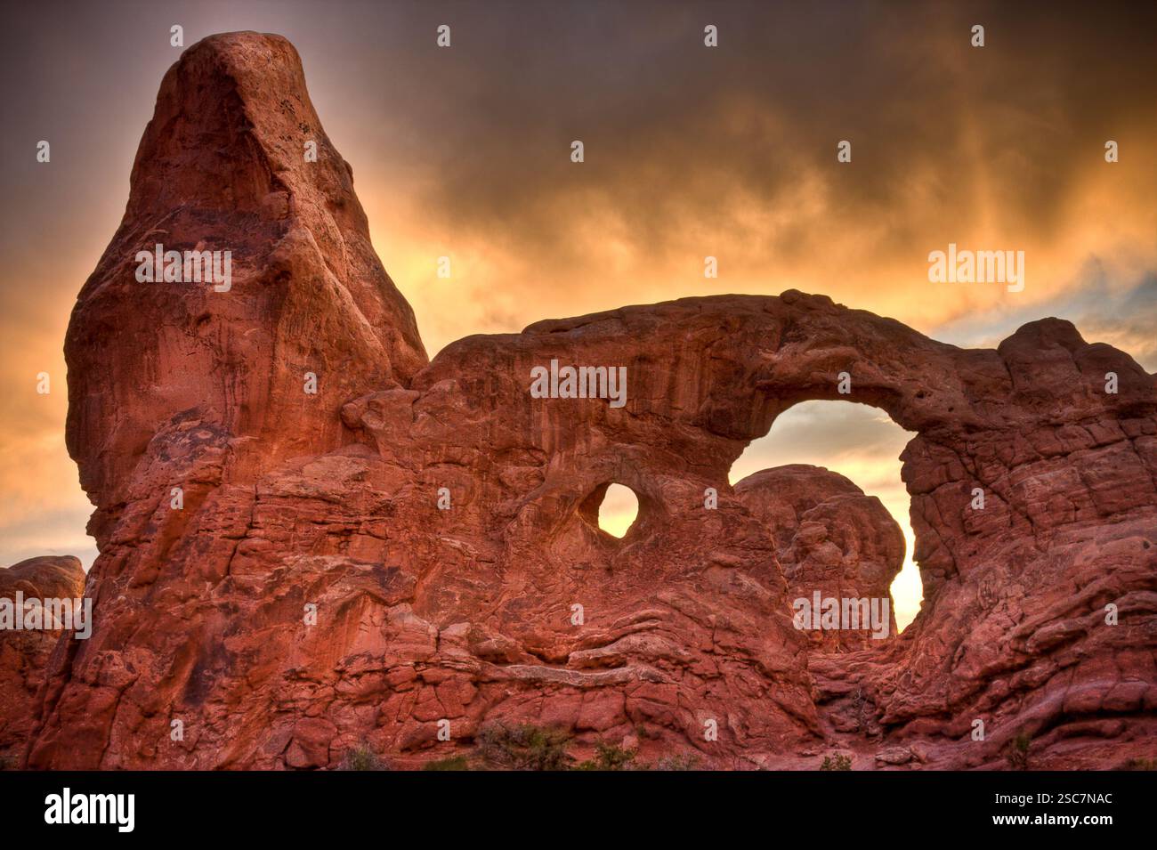 A large rock formation with a hole in the middle. The hole is ...