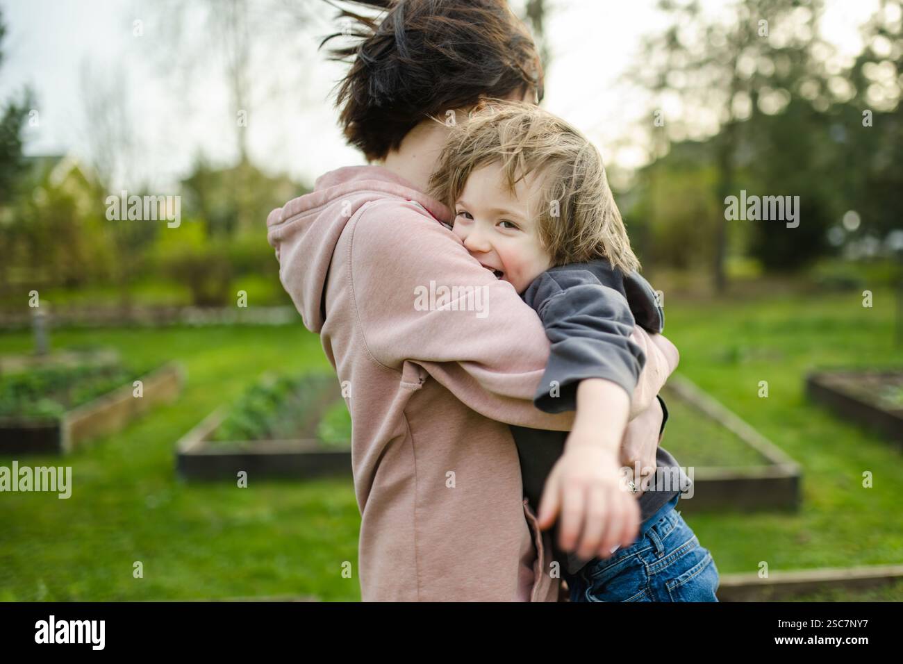 Cute big sister cuddling with her toddler brother. Adorable teenager ...
