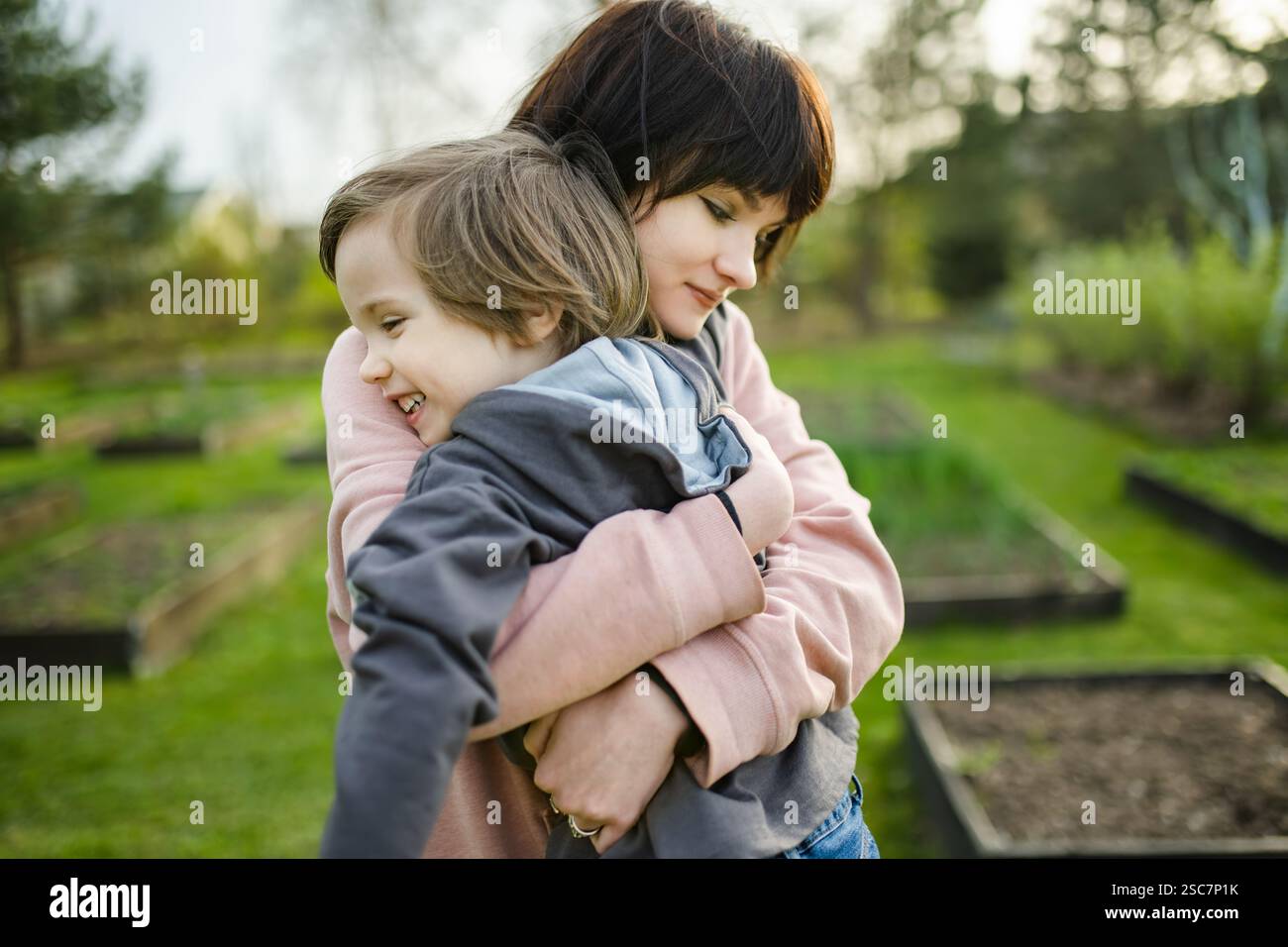Cute big sister cuddling with her toddler brother. Adorable teenager ...