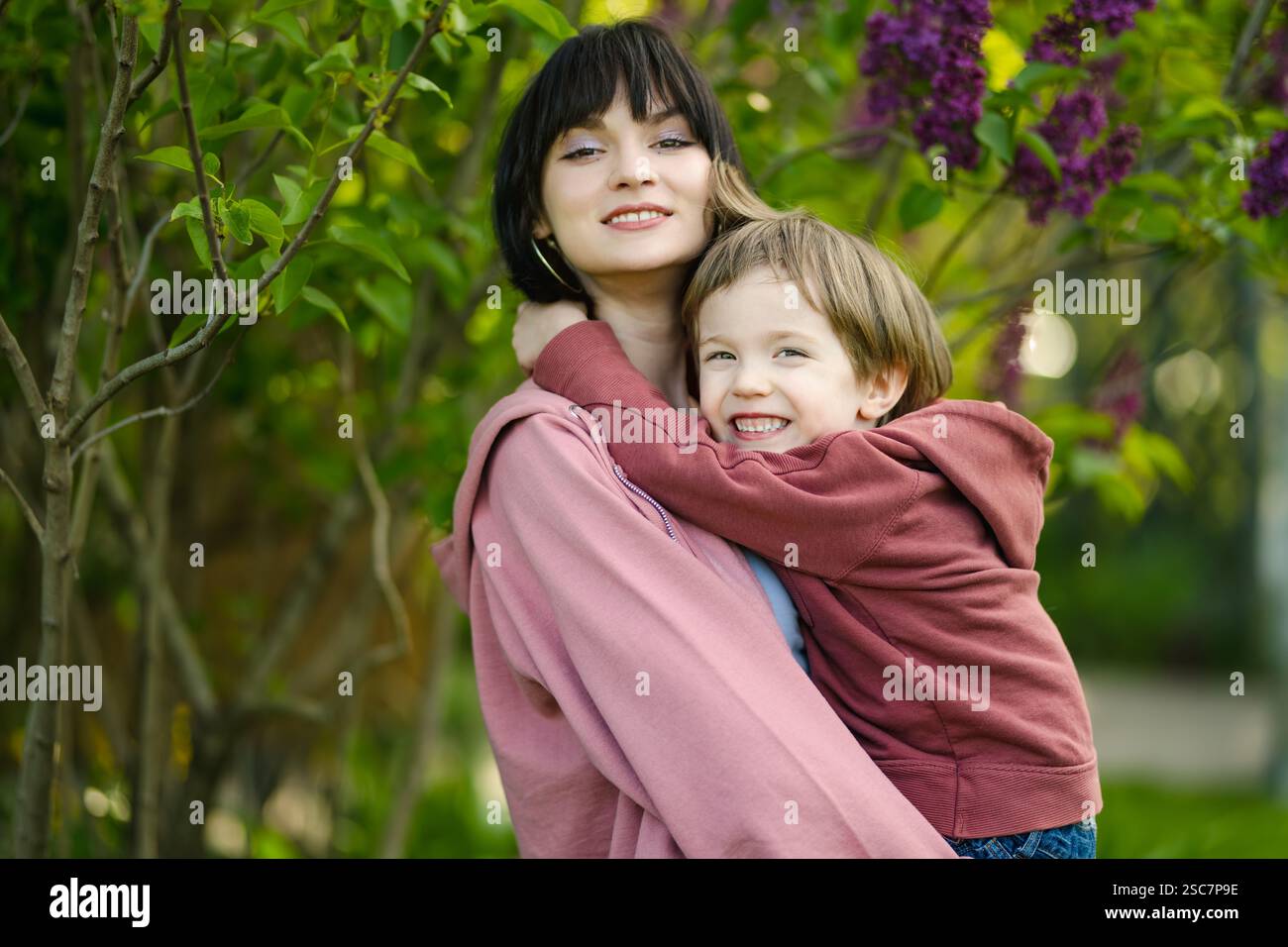 Cute big sister cuddling with her toddler brother. Adorable teenager ...