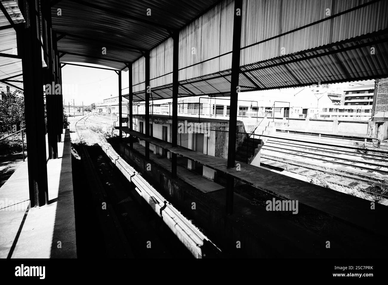 Train lines, in the background old train workshop Stock Photo - Alamy