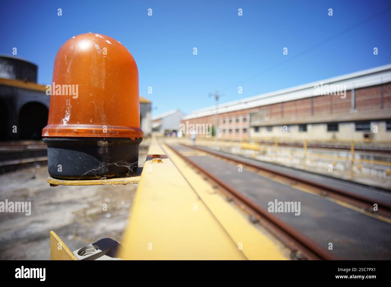 Yellow rotating indicator light for moving machines on the left side ...