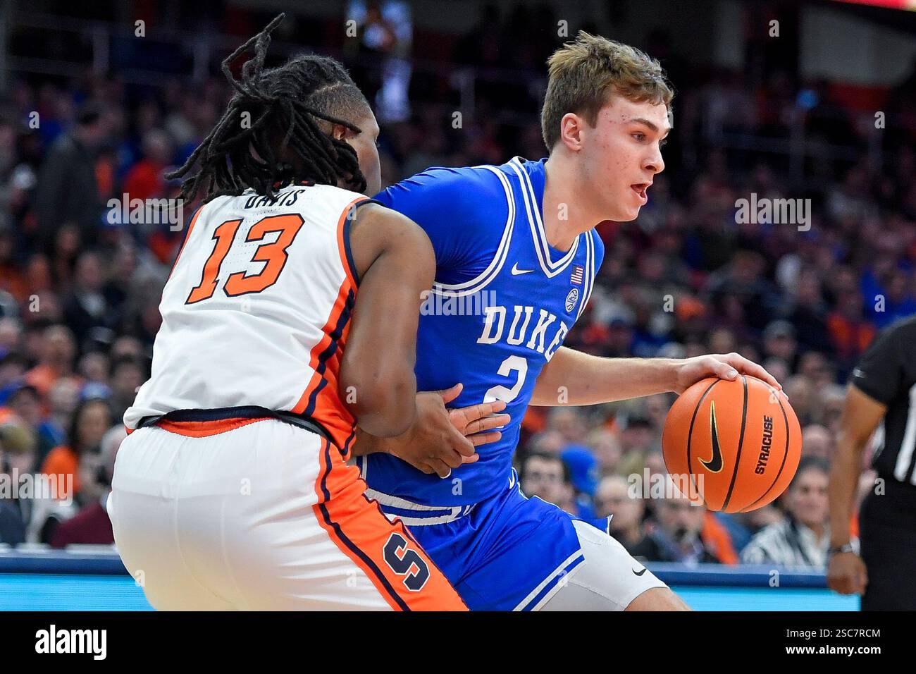 Duke guard/forward Cooper Flagg, right, is defended by Syracuse forward Jyare Davis during the ...