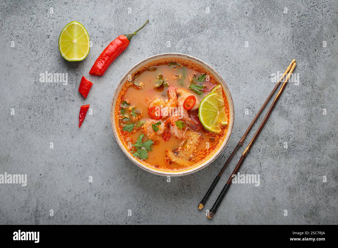 Spicy tom yum soup with prawns and lime Stock Photo - Alamy