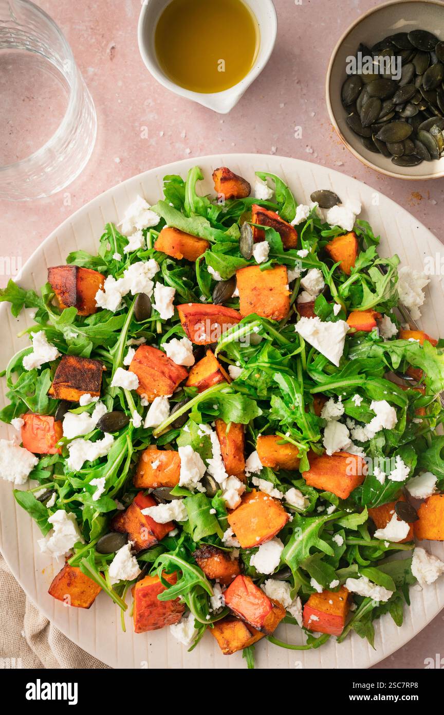 Rocket salad with roasted pumpkin and feta Stock Photo - Alamy