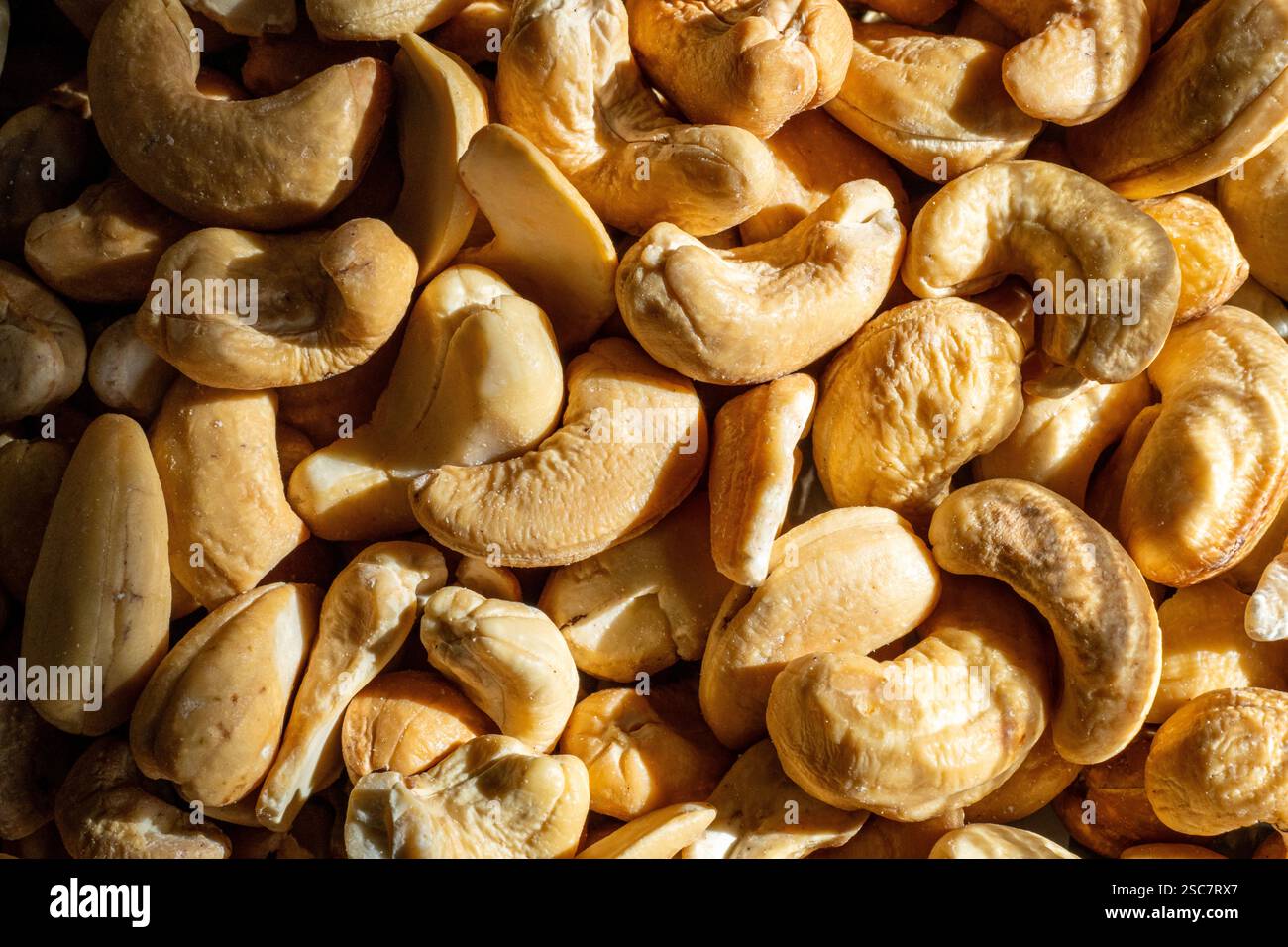 A close-up of roasted cashew nuts under natural light Stock Photo - Alamy