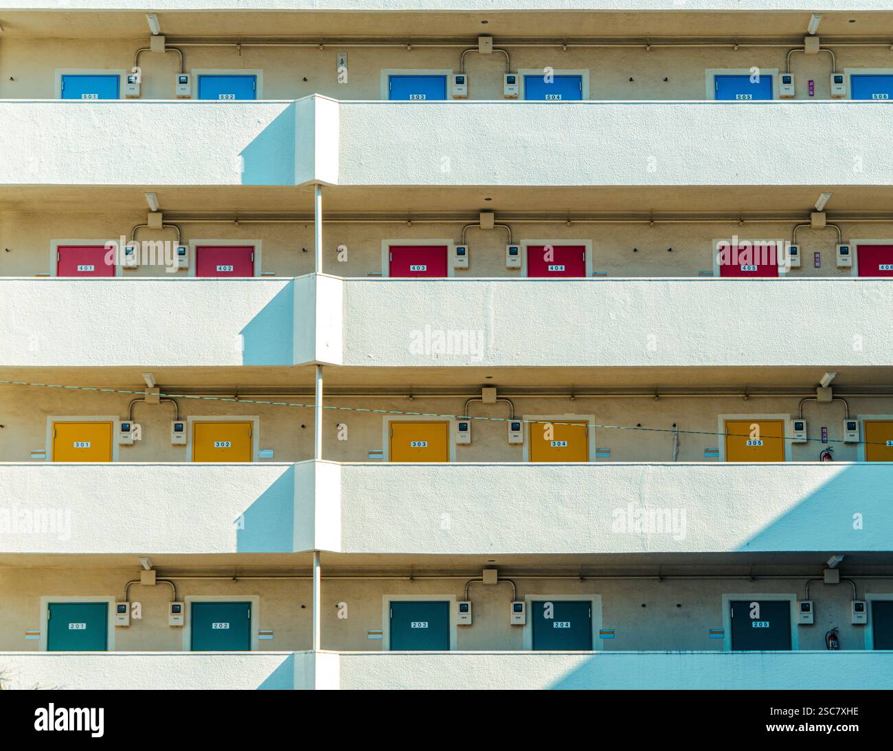 A colorful apartment building facade with primary colors an symmetric ...