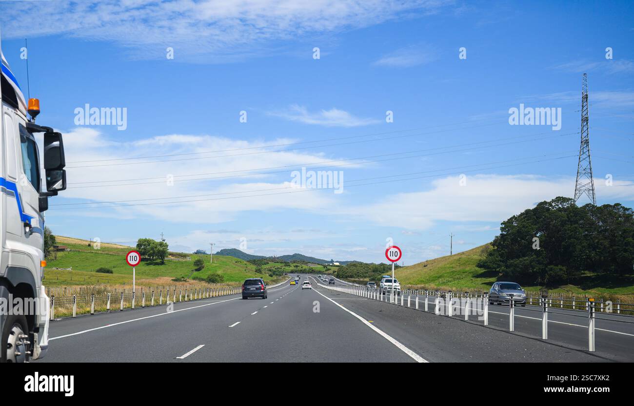 Truck driving on Waikato Expressway. 110 kmh road speed signs by the ...