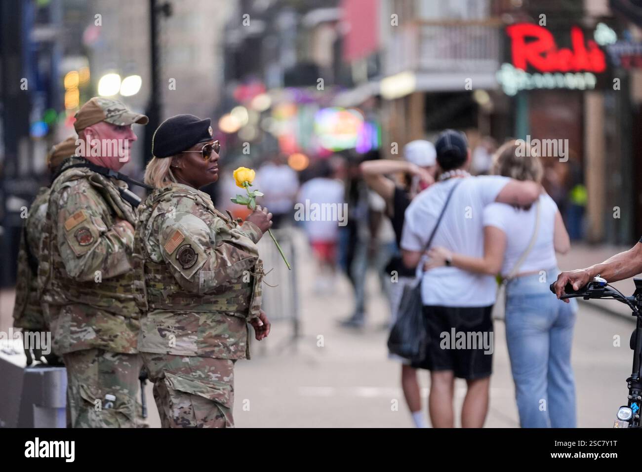 Louisiana National Guard First Sgt. Nicole Williams holds a rose that ...