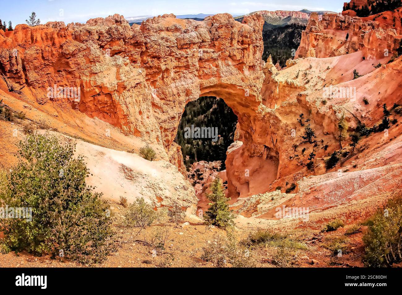A large rock formation with a hole in the middle. The hole is ...