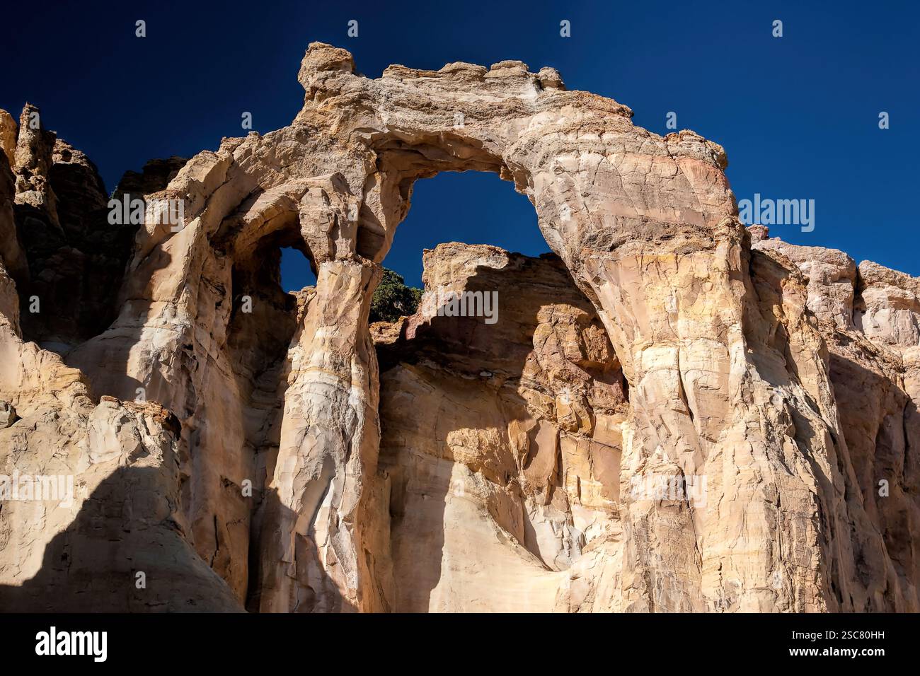 A large rock formation with a hole in the middle. The hole is shaped ...
