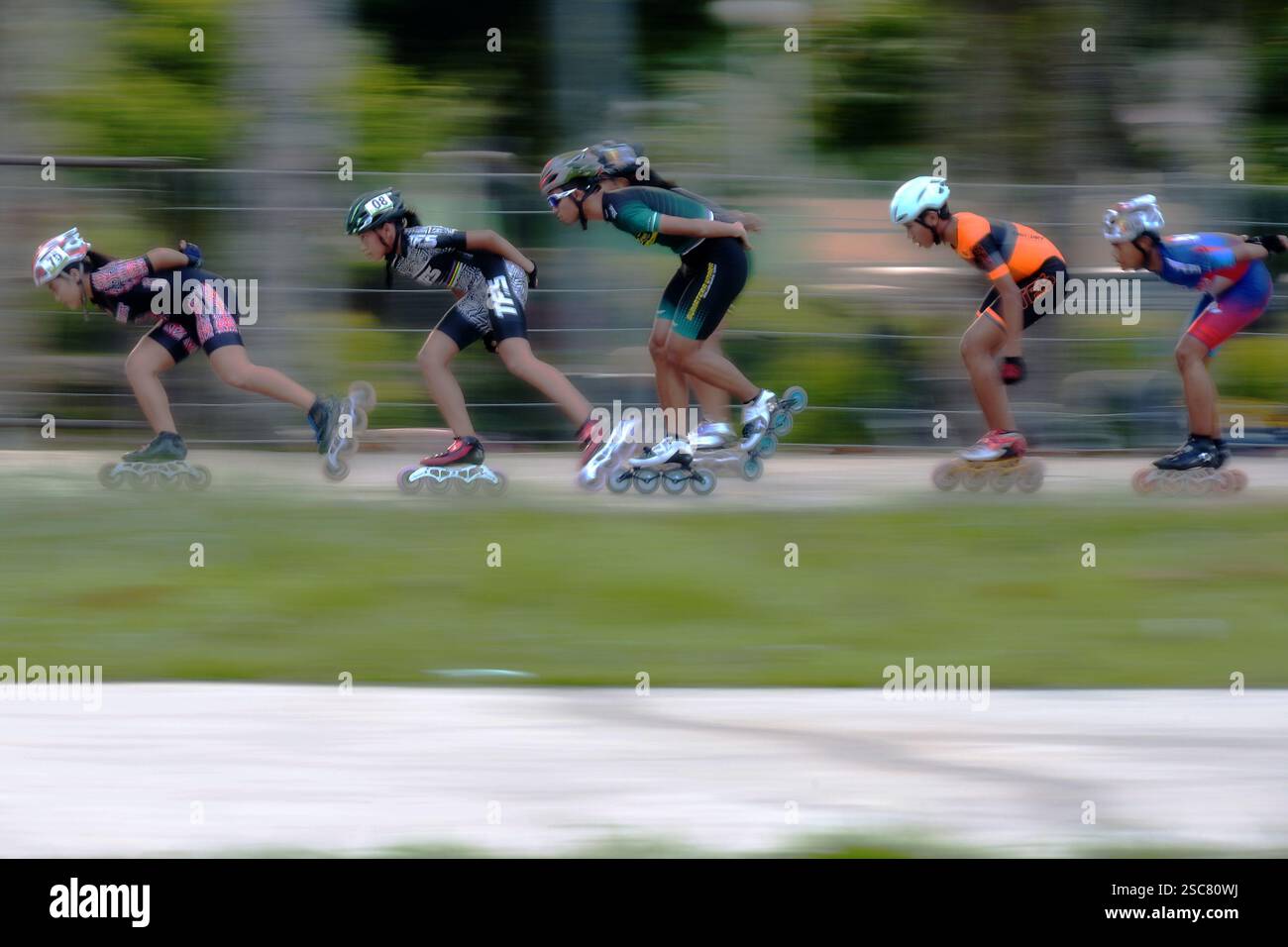 Roller skating team athletes at speed line Stock Photo - Alamy