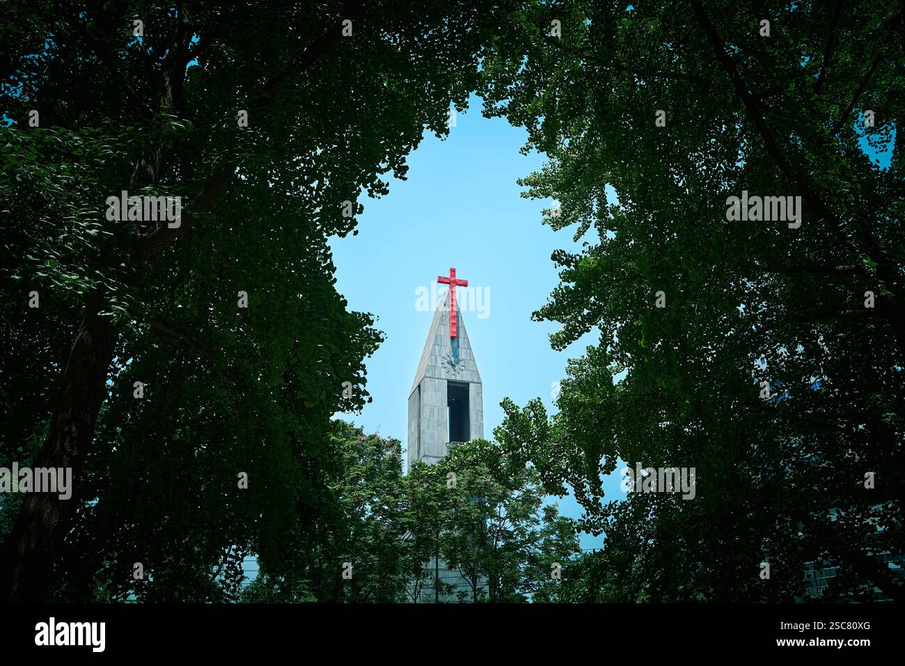 Christian Church in the shade of trees Stock Photo - Alamy