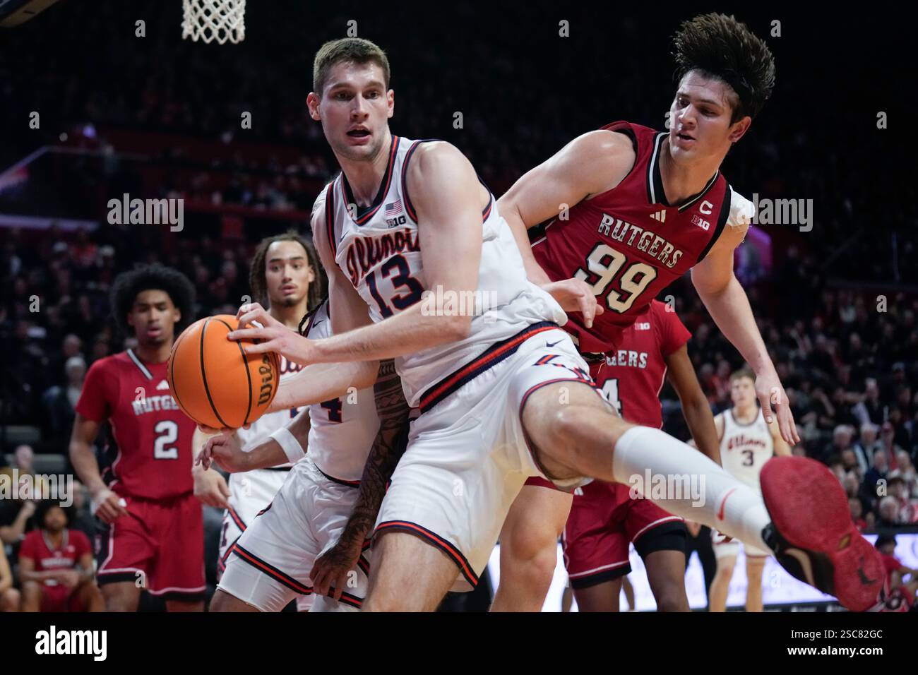 Illinois' Tomislav Ivisic, left, and Rutgers' Zach Martini fight for a ...