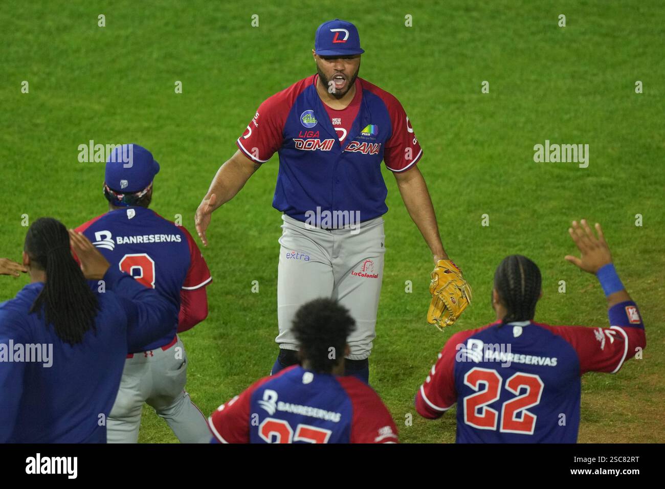 Dominican Republic's pitcher Jimmy Cordero, top, celebrates after a ...