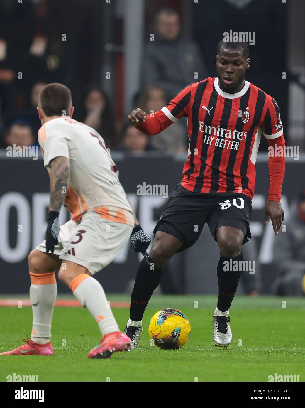 Milan, Italy. 5th Feb, 2025. Yunus Musah of AC Milan takes on Esmoris Angelino of AS Roma during ...