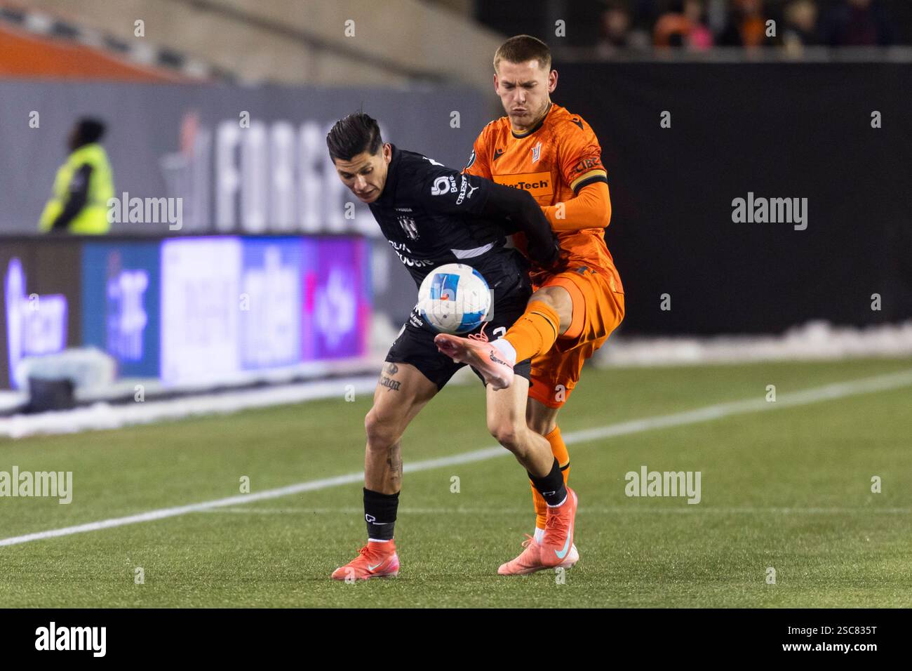 C.F. Monterrey defender Gerardo Arteaga (left) fights for a ball with ...