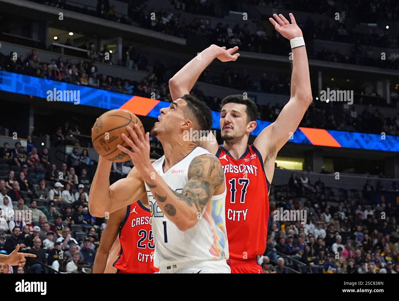 Denver Nuggets forward Michael Porter Jr., front, goes up for a basket ...