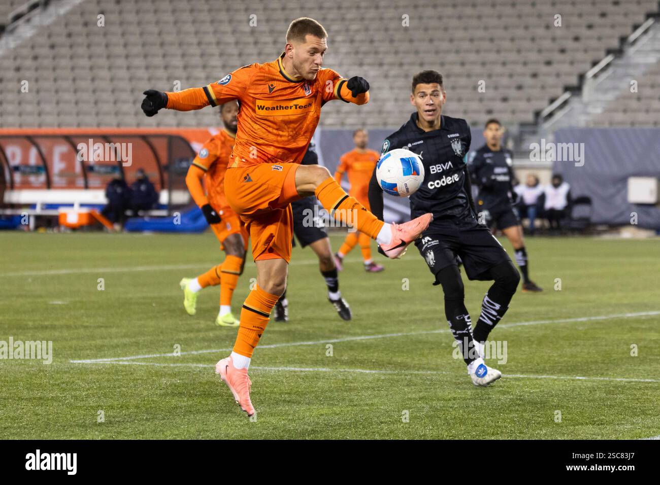 Hamilton Forge FC defender Rezart Rama (left) settles a ball down ...
