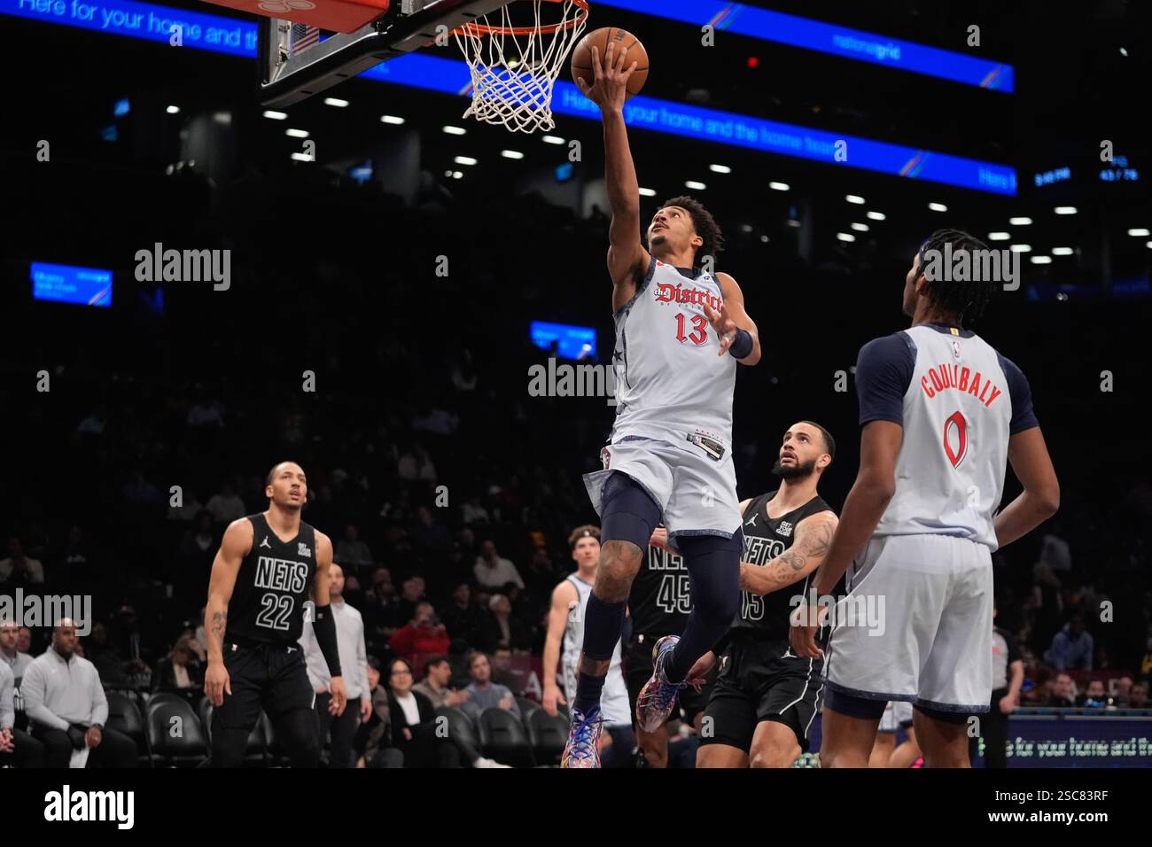 Washington Wizards' Jordan Poole (13) drives past Brooklyn Nets' Tyrese ...